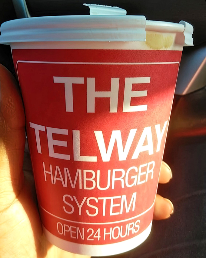 Their coffee comes in cups proudly declaring "THE TELWAY HAMBURGER SYSTEM"—like they've figured out the secret formula to happiness.