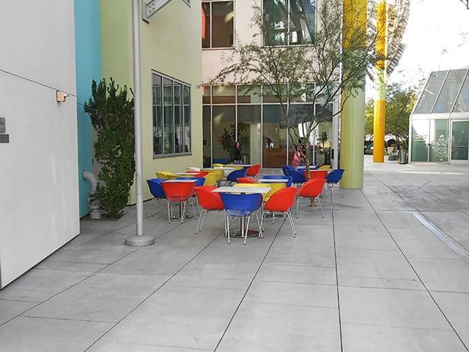 These cheerfully colored seating areas offer respite for weary shoppers and patient partners alike&mdash;the Switzerland of retail warfare.