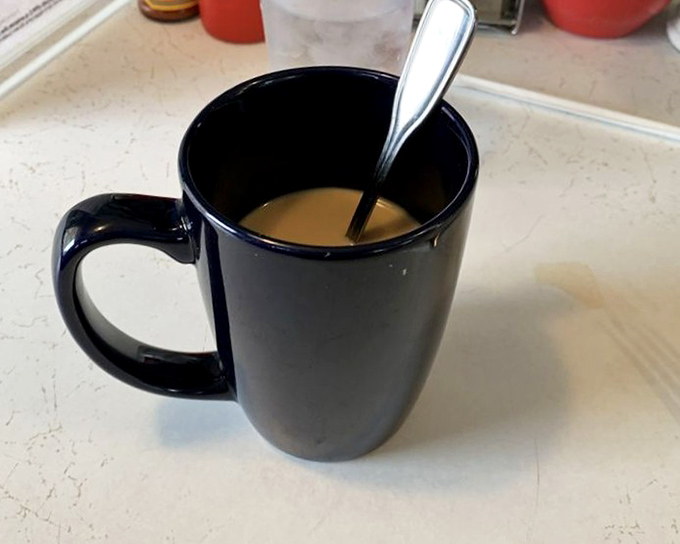The official chalice of morning salvation. This isn't just coffee&mdash;it's liquid motivation with the diner's address, in case you need to find your way back tomorrow.
