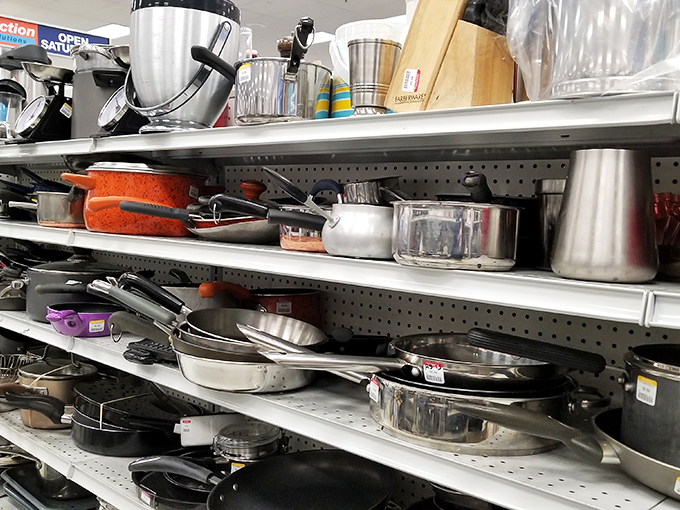 The cookware aisle: where cast iron pans with decades of seasoning wait to elevate your cooking game beyond anything non-stick could offer.