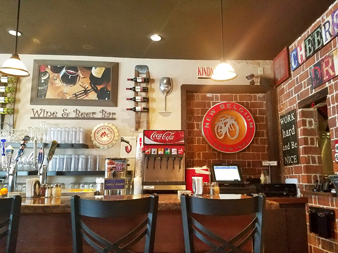 The bar area beckons with its warm lighting and impressive selection of libations &ndash; the perfect spot to debate your next pizza order.