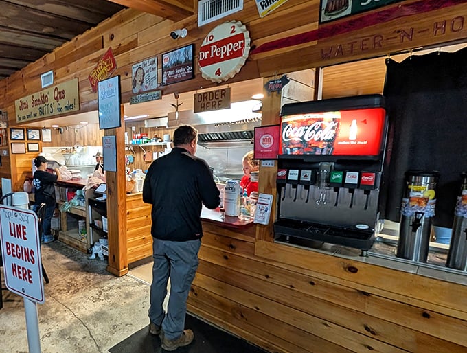 The moment of truth – placing your order at barbecue's altar. That "Line Begins Here" sign might as well say "Patience Rewarded Beyond This Point."