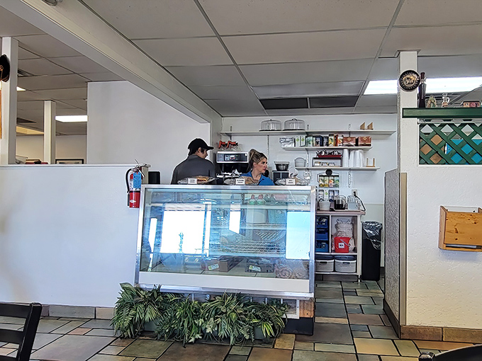 The pass-through window where breakfast dreams become reality. Like watching artists at work, but the canvas is your plate.