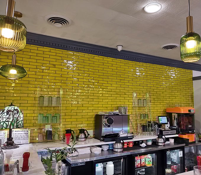 Green glass pendant lights hang like jewels above the coffee station. This isn't just caffeine &ndash; it's the morning fuel that powers Bellbrook.