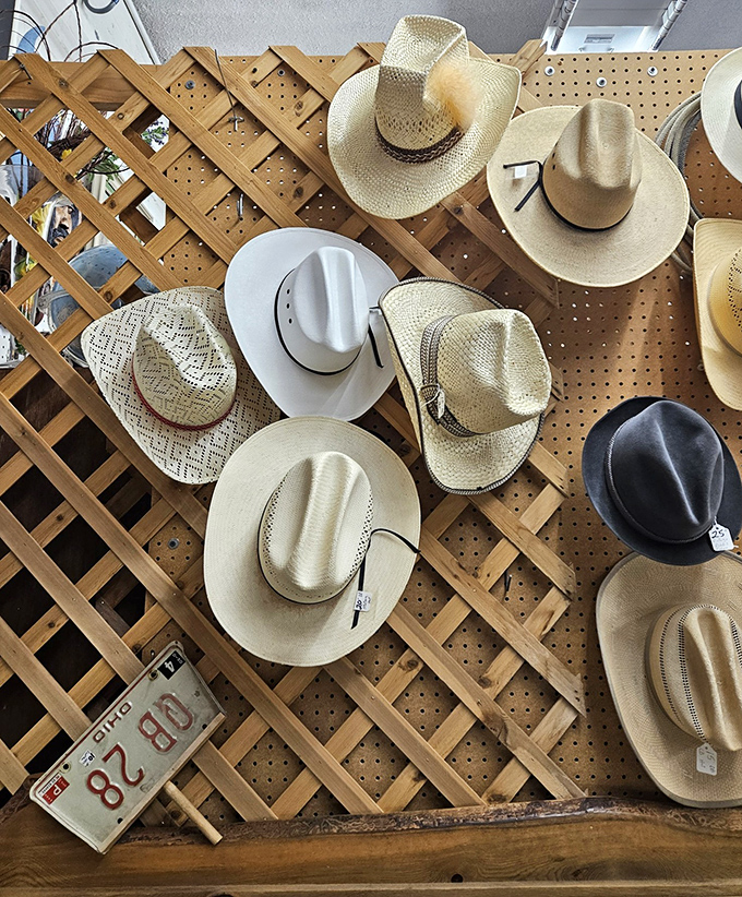 The cowboy hat wall&mdash;where Western heritage meets practical headwear in a display that screams "Wyoming" louder than a rodeo announcer.