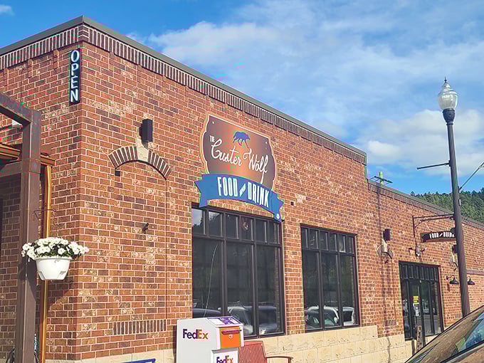 Custer Wolf's vintage brick and blue signage promises food and drink where locals actually gather, always the best recommendation you can get.