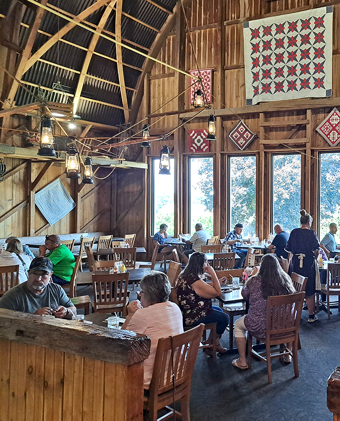 Where strangers become neighbors over plates of home cooking. The barn's wooden beams and quilt decorations remind us that some traditions are worth preserving.