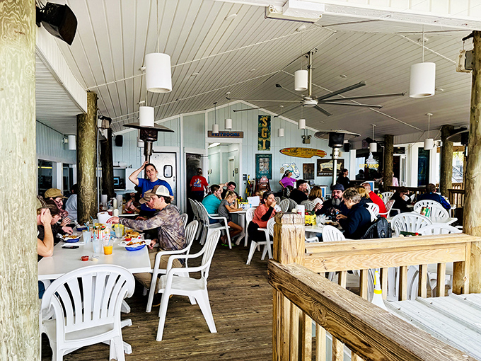 The dining deck fills with happy chatter as plastic chairs become front-row seats to the greatest show on earth—authentic Florida seafood.