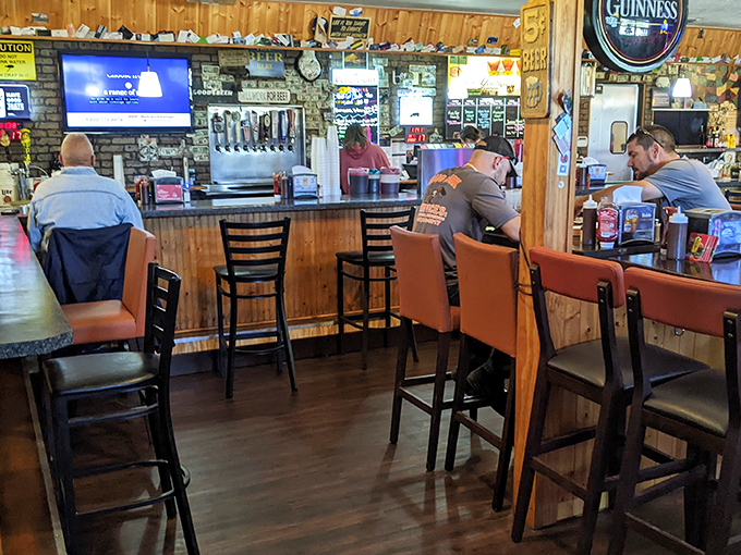 Where locals gather at the counter, trading barbecue opinions and football predictions while waiting for their next smoked meat fix.