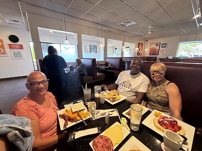Happy diners caught in their natural habitat&mdash;that moment when conversation pauses because the food demands complete and undivided attention.