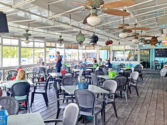 Where ceiling fans and conversation flow with equal ease&mdash;a dining room that invites you to linger just a little longer.