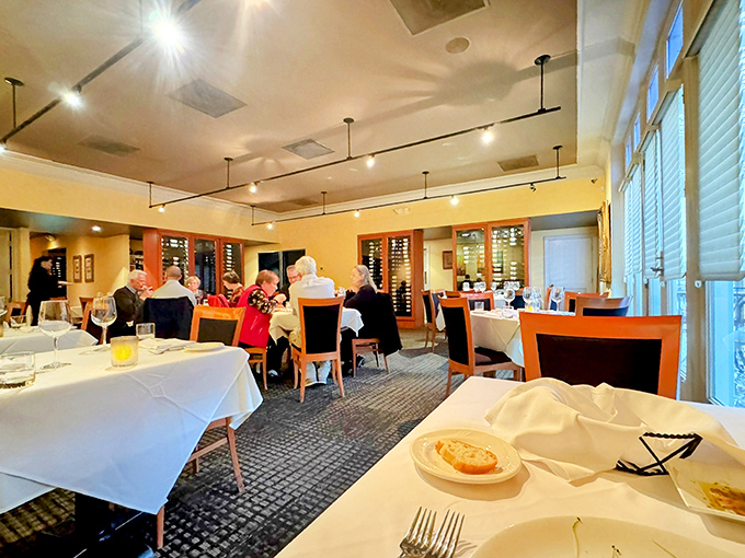 White tablecloths and warm lighting transform dinner into an occasion, where every table holds the promise of memories being made.