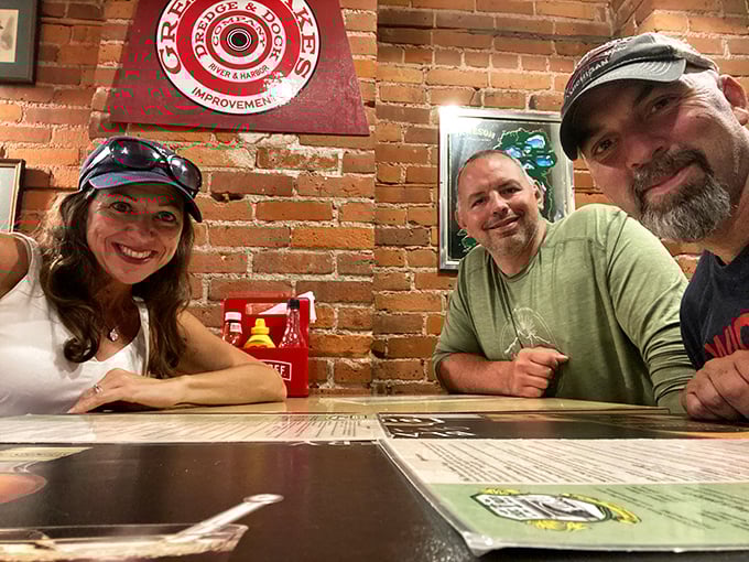 Happy patrons gathered around exposed brick walls &ndash; the universal sign that you've found a place where good food and good company intersect.