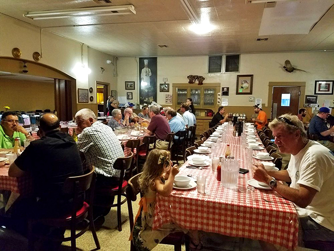 A dining room buzzing with the universal language of satisfaction&mdash;where strangers become dinner companions over shared plates.