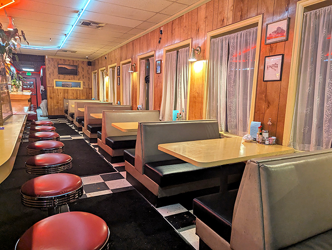 Classic booths line the wall, each one a potential setting for your own small-town diner scene.