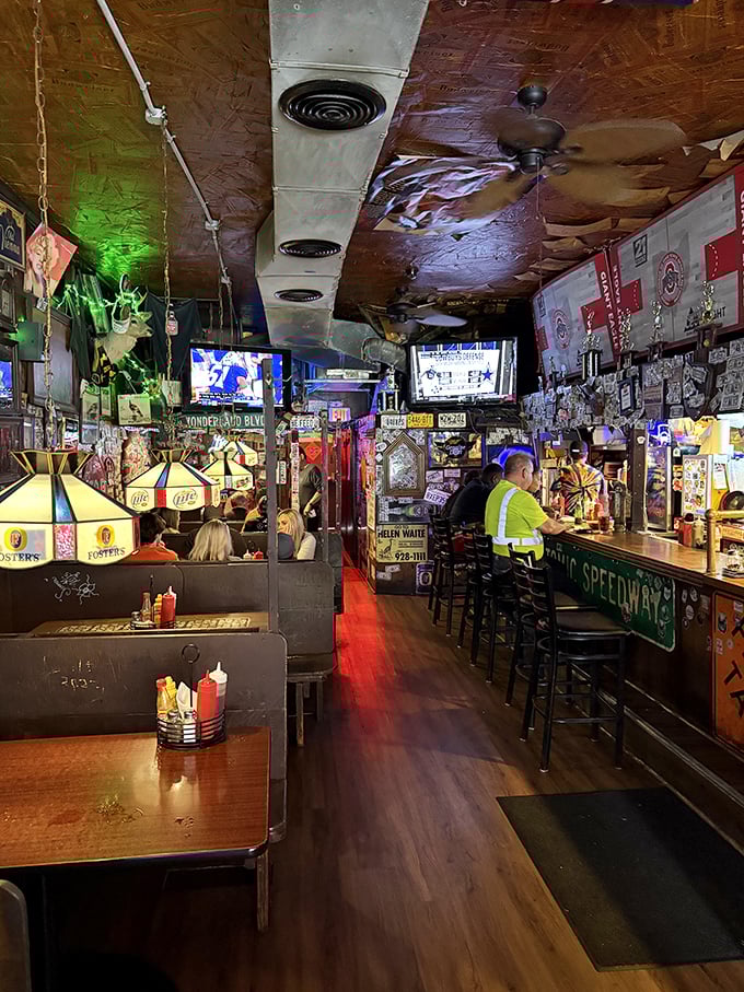 Where burgers meet sports meet conversation. The neon glow isn't just lighting&mdash;it's the aura of decades of good meals.