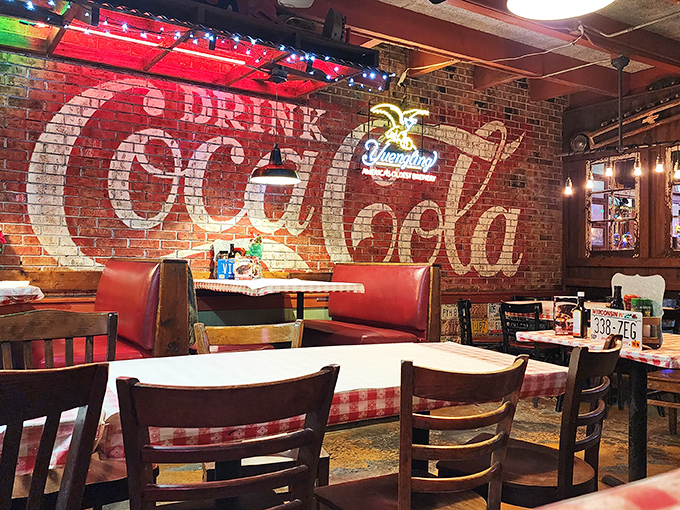 That Coca-Cola wall mural isn't just decoration—it's a time machine to when dining out was an occasion and comfort food reigned supreme.