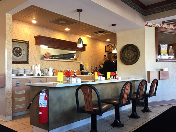 The counter where breakfast magic happens. Those stools have supported thousands of happy customers contemplating second helpings.