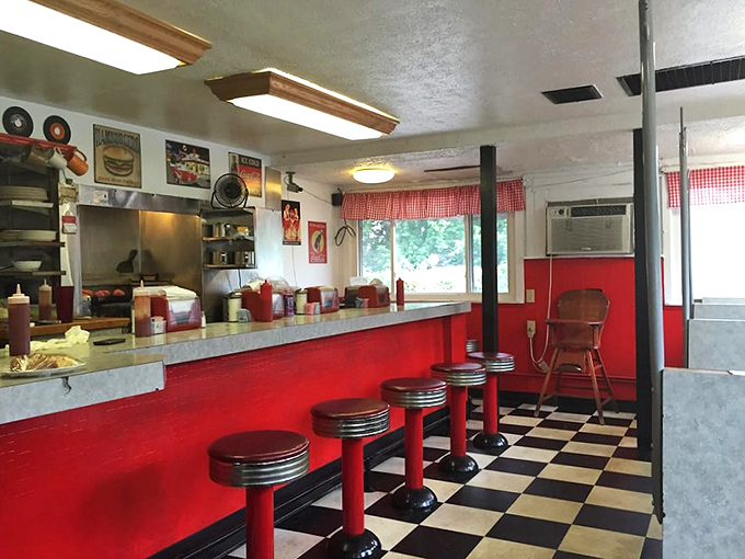 Red stools lined up like patient sentinels, each one having supported generations of Ohioans seeking solace in perfect diner fare.