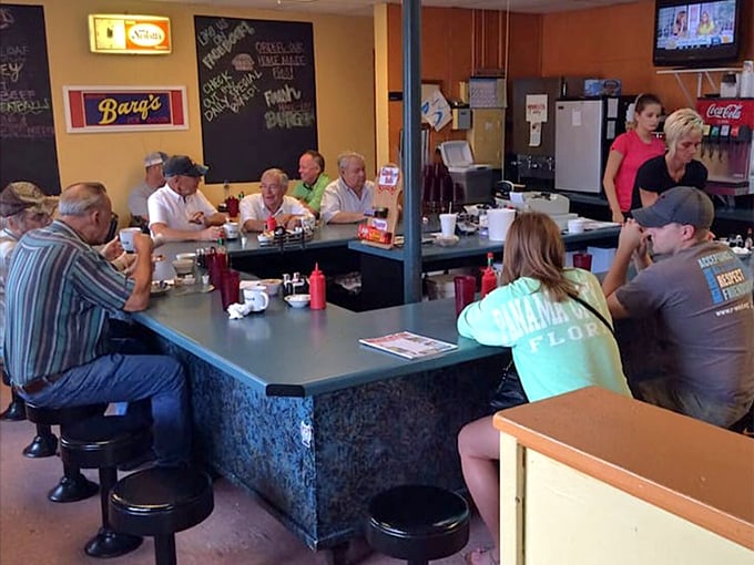 Regulars gathering around the counter like it's their kitchen table, because great diners create family wherever people sit.