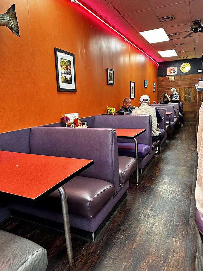 Orange walls and purple booths shouldn't work together, but somehow they create the perfect backdrop for life's most important meal.