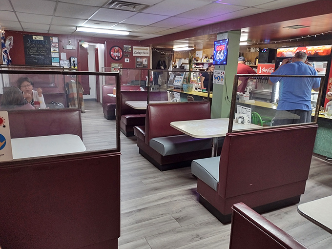 Booths divided by plexiglass – the modern touch in a vintage setting, like putting power windows in a '57 Chevy. Still classic, just slightly updated.