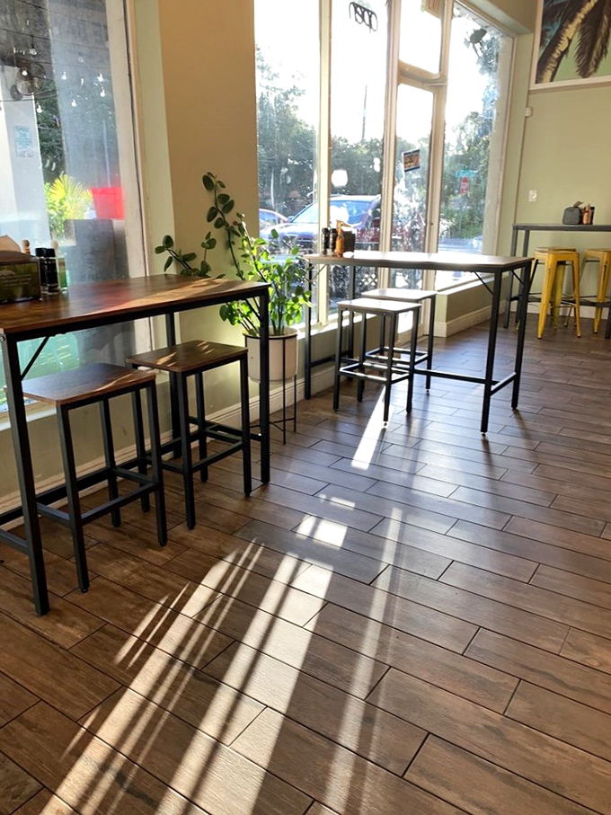 Sunlight streams through tall windows, creating the perfect setting for contemplating life's big questions, like "Should I order a second sandwich?"