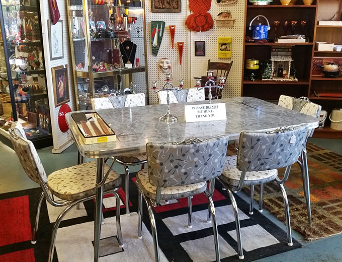 The classic chrome-and-formica dining set that defined American kitchens for decades. That "Please Do Not Sit" sign is practically begging to be ignored.