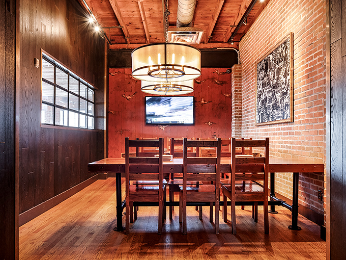 Private dining that feels like you've scored the best table in the house. Exposed brick and warm lighting set the mood.