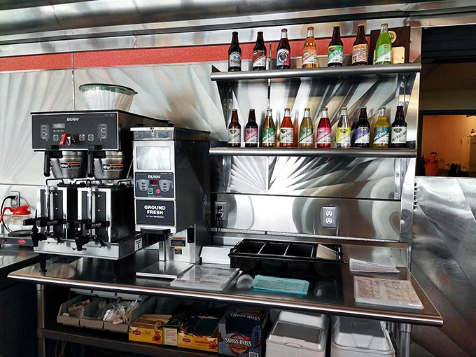 The coffee station stands ready for action, a caffeinated command center flanked by colorful soda bottles &ndash; the unsung heroes of any proper American diner experience.