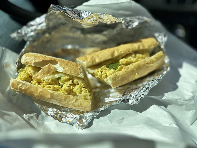 The humble egg sandwich elevated to art form – simple ingredients treated with respect create breakfast magic here.