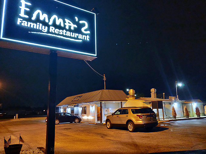 Emma's neon sign cuts through the darkness, promising home-style cooking that makes chain restaurants seem as soulless as their corporate headquarters.