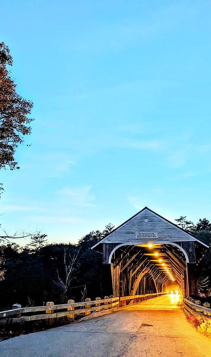 Twilight brings a special magic, as warm lights illuminate the bridge's interior&mdash;a golden pathway across darkening waters.