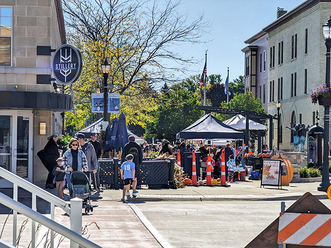 Downtown comes alive during festivals, where a distillery sign hints that Grafton knows how to balance wholesome family fun with adult refreshments.