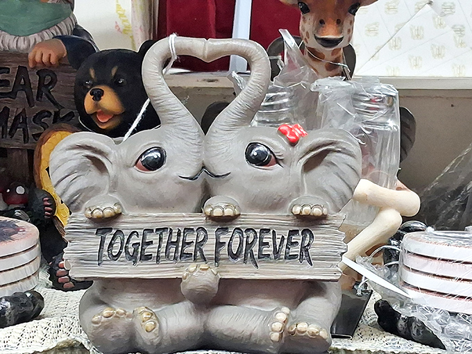 "Together Forever" proclaims this elephant figurine, embodying both the charm and occasional kitsch that makes vintage shopping an adventure in taste.