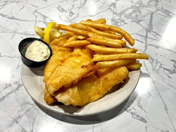 Fish and chips with a side of tartar sauce&mdash;crispy on the outside, flaky within. The kind of comfort food that transcends oceans.