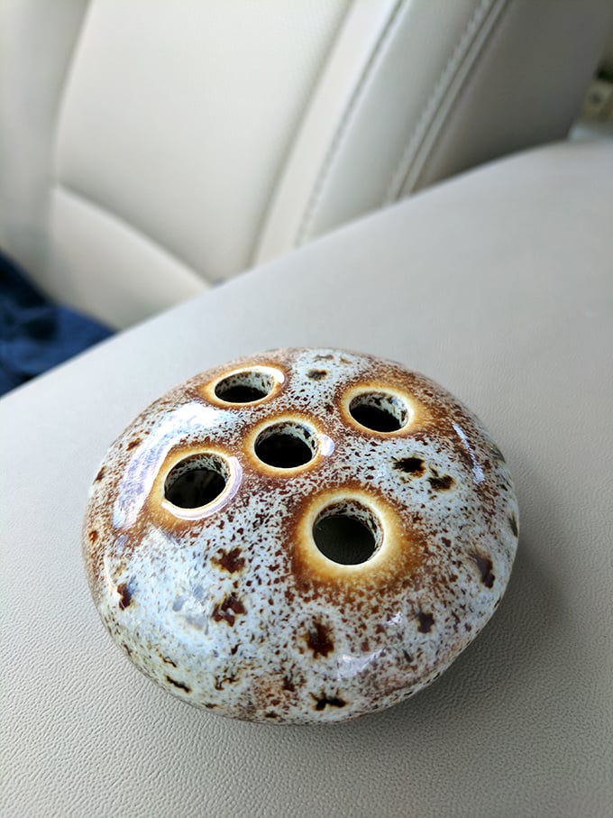 Nature meets artistry in this unusual flower frog&mdash;a ceramic piece that's both functional and sculptural, perfect for the vintage-loving gardener.