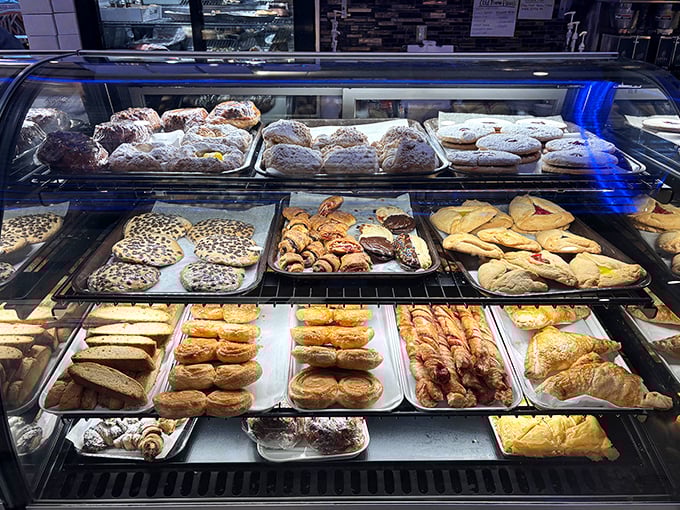 A pastry case that should come with a warning label: "Caution: May cause spontaneous dessert decisions regardless of how full you are."