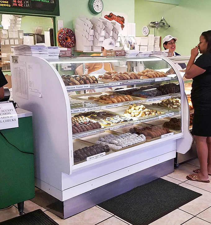 Layer upon layer of donut varieties await your selection. Decision paralysis has never been so deliciously challenging or rewarding.