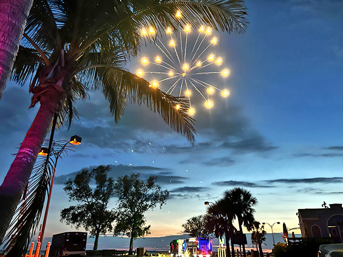 Fireworks illuminate Venice's twilight sky, painting the palm trees in celebratory light. Small-town celebrations with big-time magic.