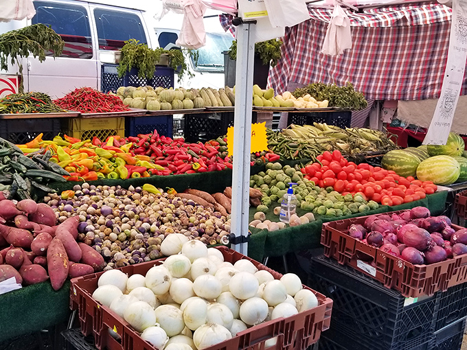 Nature's color palette on full display. This produce stand's vibrant fruits and vegetables could inspire both your dinner menu and your next painting.
