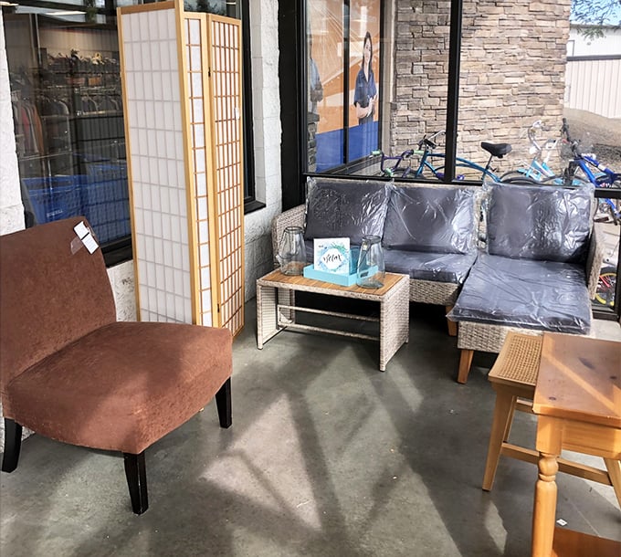 A furniture vignette that whispers possibilities – the Japanese screen, wicker patio set, and wooden table waiting to define a new space.