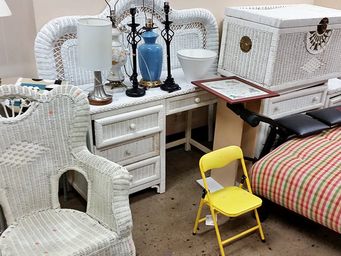 Wicker furniture grouping that whispers "sunroom potential" for a fraction of retail. That yellow folding chair? Pure bonus points for quirky charm.