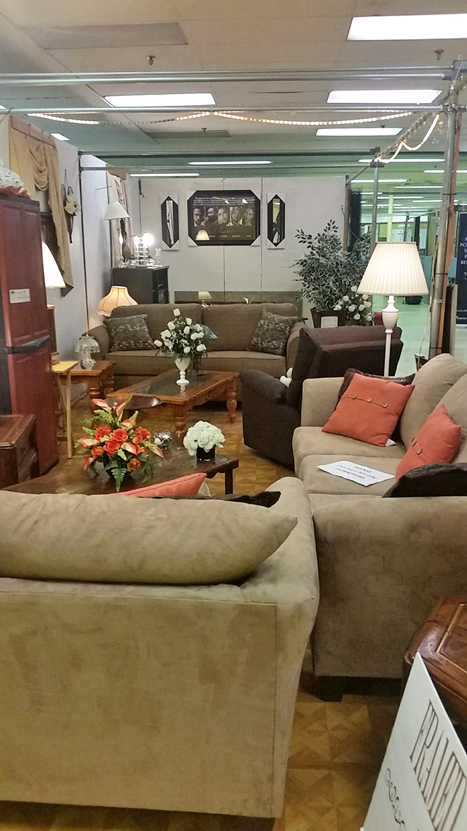 A living room display that looks ready for an impromptu family reunion. That lamp has definitely seen some interesting conversations.