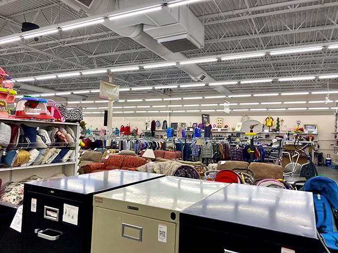 File cabinets and furniture await new homes. In the background, enough couches to furnish a small apartment building lurk enticingly.