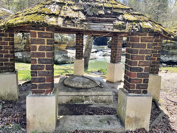 This weathered gazebo has witnessed countless picnics, proposals, and peaceful moments&mdash;a brick-and-mortar time capsule beside the flowing springs.