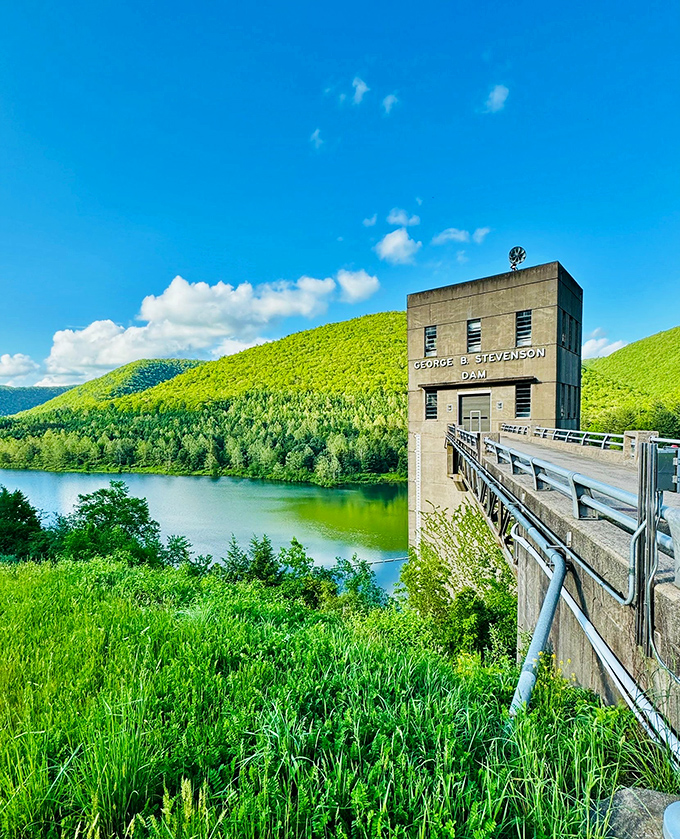 The George B. Stevenson Dam stands like a concrete sentinel, holding back waters that reflect Pennsylvania's emerald mountains with mirror-like precision.