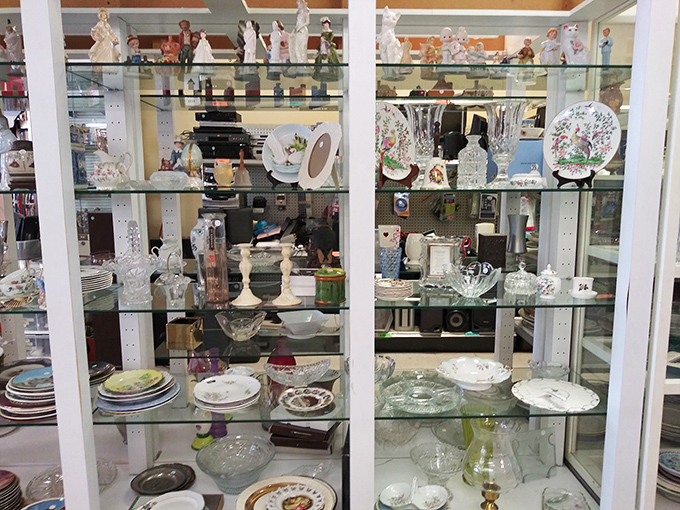 Crystal and collectibles behind glass &ndash; because someone else's "I'm downsizing" becomes your "I've always wanted a complete set of that!"