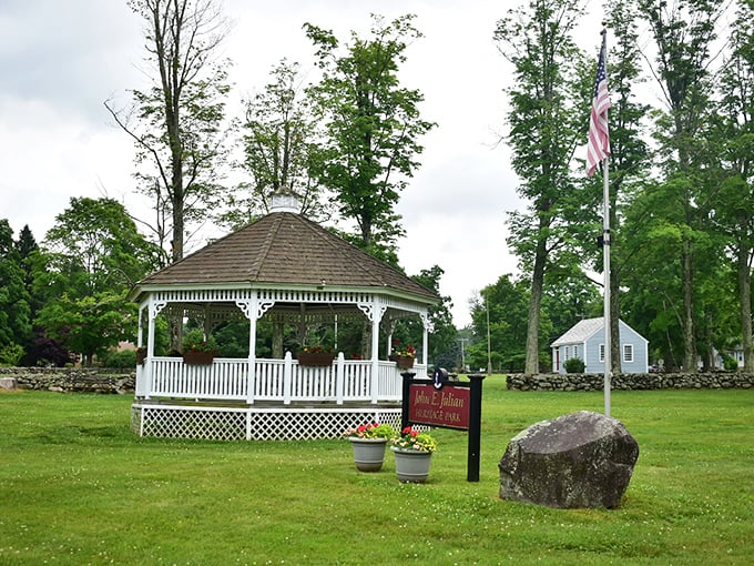 The town gazebo anchors this peaceful green space where community gatherings happen on every budget imaginable.