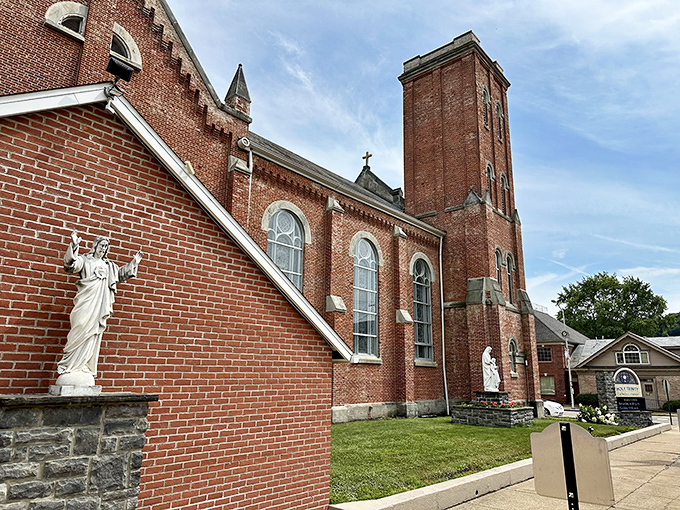 Holy Trinity Parish Church reaches skyward with its impressive brick tower &ndash; spiritual comfort wrapped in architectural splendor that anchors the community.